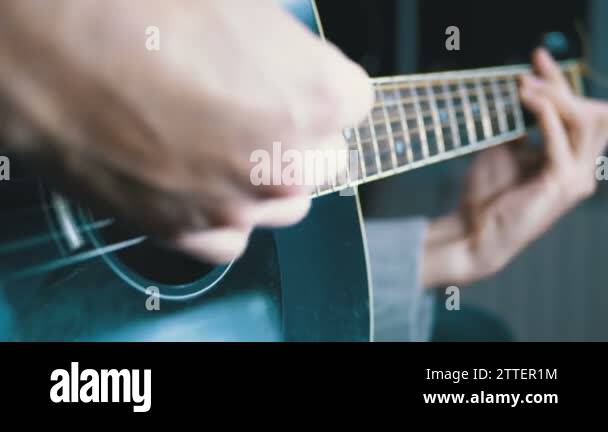 Man Playing an Acoustic Guitar. Slow motion. Close-up neck guitar ...
