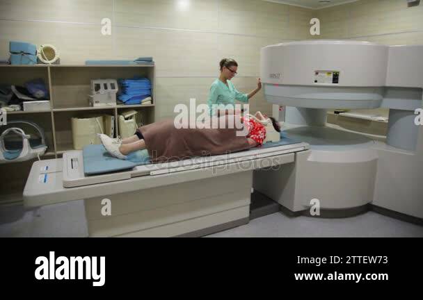 Computed tomography lab. MRI machine and screens with doctor. Scan ...