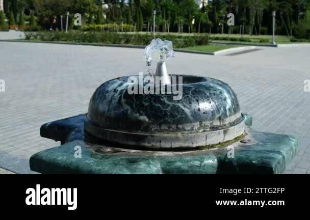 Water flows from the drinking water fountain. Square in front of Sameba ...