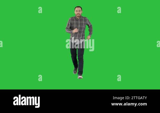 Man running on a Green Screen, Chroma Key Stock Video Footage - Alamy