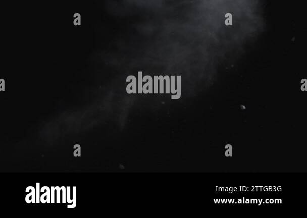 Dusty bullet hit on a wall with chunks of debris flying out. White ...