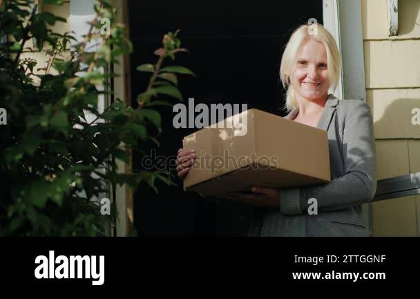 Woman parcel door delivery Stock Videos & Footage - HD and 4K Video ...