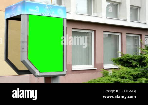 Billboard on phone booth - green screen - building with windows in ...
