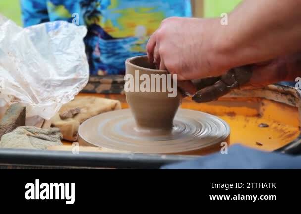 clay vessel created via the electric potter machine by hand. The first ...