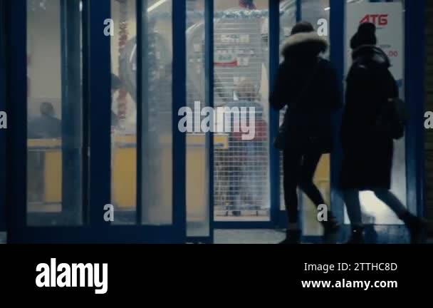 DNIPRO, UKRAINE - JANUARY 12, 2019: People enter and exit through ...