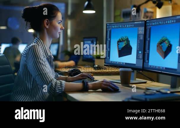 Female Game Developer Works on a Level Design on Her Personal Computer ...