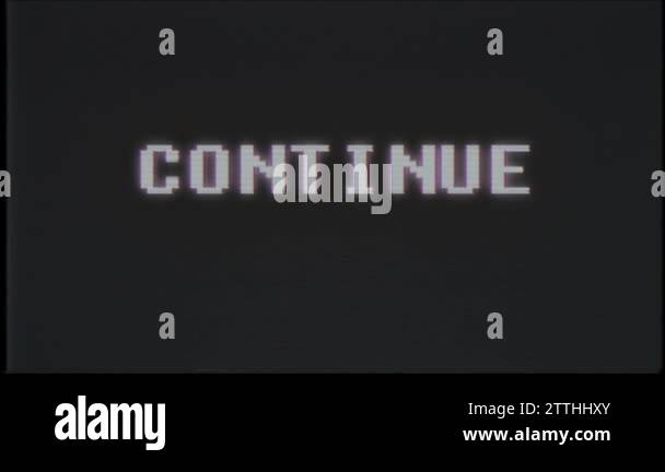 retro videogame CONTINUE text on computer old tv vhs glitch ...