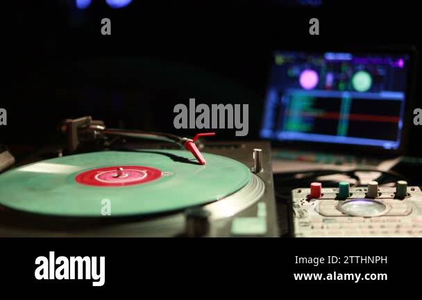 DJ Spinning, Mixing, and Scratching in a Night Club. Macro Shot Of A ...
