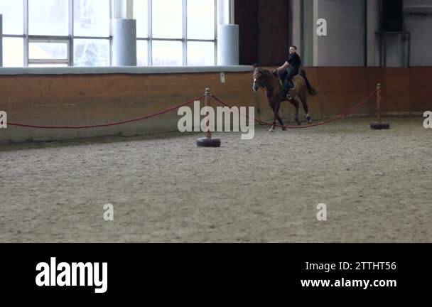 A man riding trick and Vaulting on horse. A man riding a horse upside ...