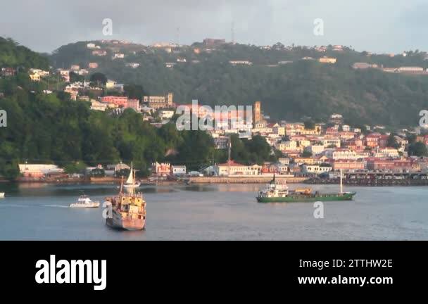 Cargo vessels on raid and city on coast. St. George's, Grenada Stock ...