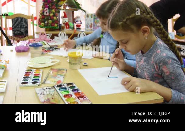 Two girls draw at their desks in the drawing lesson Stock Video Footage ...