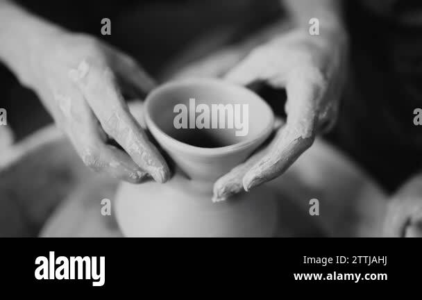 Traditional pottery making, man teacher shows the basics of pottery in ...