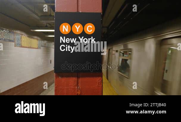 Manhattan Subway Approaches the Platform with New York City Sign Stock ...