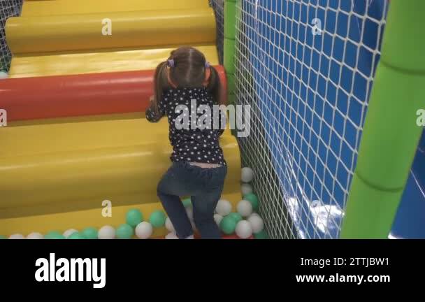 Kid climbing on stairs in childrens play center Stock Video Footage - Alamy