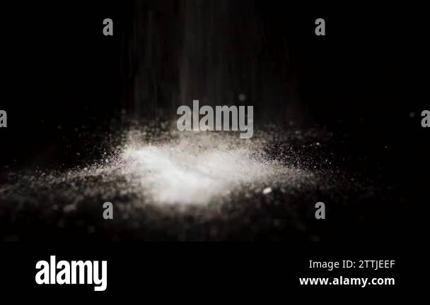 Launched powder, isolated on black background. White powder pours ...