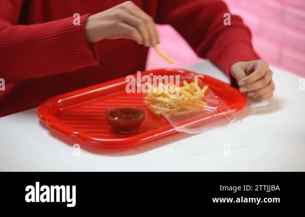 Woman showing no gesture refusing to eat sweet glazed donut, junk food ...