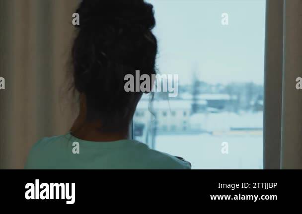 Young models in a modern high-rise house with full length windows ...