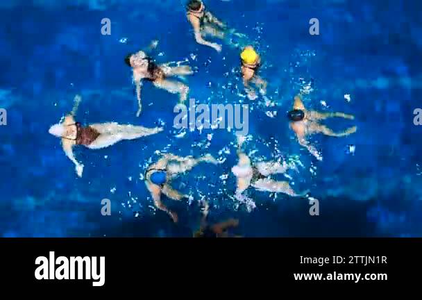 Synchronized swimming. Young girls learn swimming in the pool. Young ...