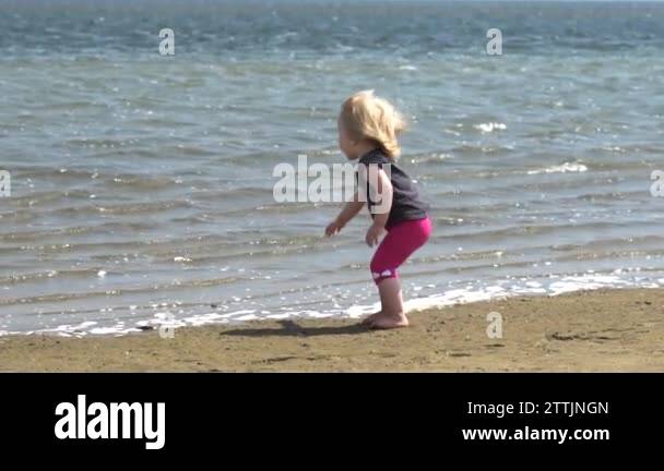 Ecstatic child by the lake. Little girl on nature. Unity with nature ...