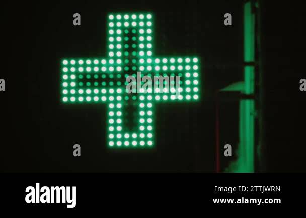Outdoor twinkling led green cross animation sign on 24-hour drugstore ...