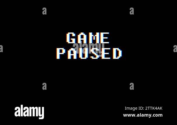 retro videogame GAME PAUSED text on computer old tv glitch interference ...