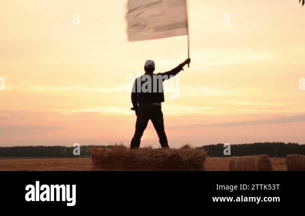 Man waving a flag Stock Videos & Footage - HD and 4K Video Clips - Alamy