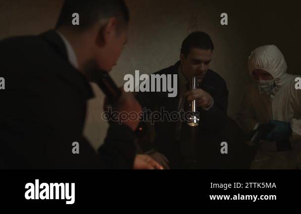 4K Police detectives and forensics team investigating dead body at a ...