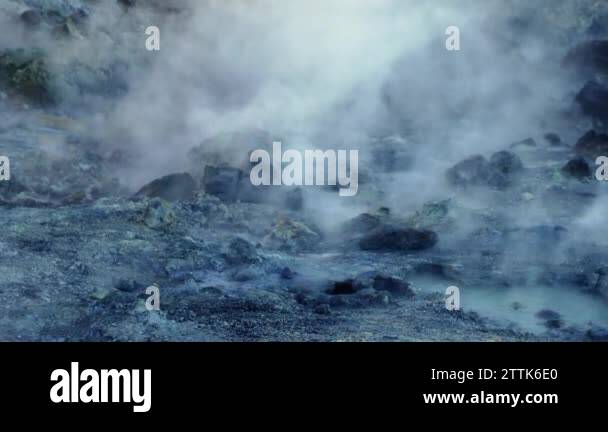 Sulfuric steam coming out from underground air vents and puddle of ...