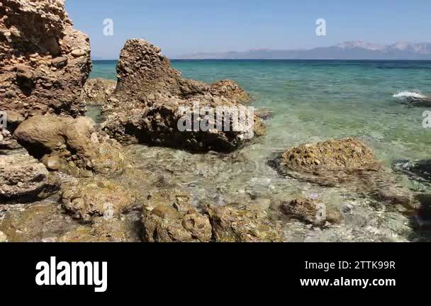 Rock is sticking out above the shoal water, above the sea level Stock ...