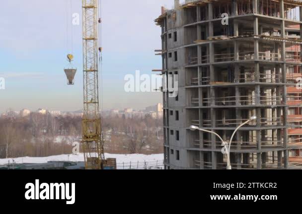 Work tower crane at the construction site. The crane moves the bunker ...
