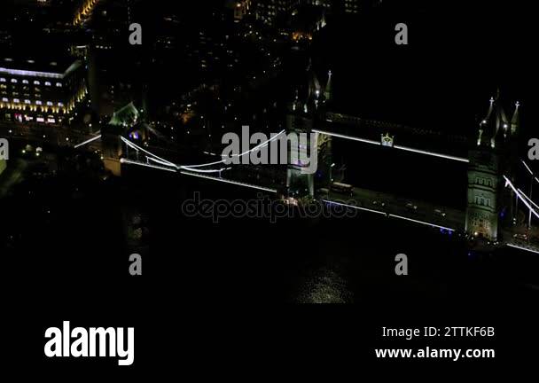4K Aerial view of traffic crossing London's iconic Tower Bridge at ...