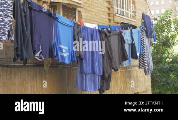 hanging clothes drying laundry lines in building Stock Video Footage ...