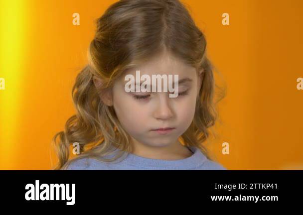 Cute girl crying and closing eyes with hands, suffering nightmares ...