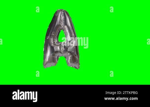 Big Letter A from alphabet helium silver balloon floating on green ...
