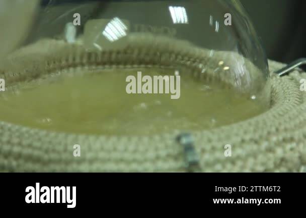 The process of solution boiling in a flask in a chemical laboratory ...
