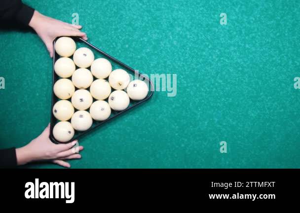 Billiards club. Forming a triangle of the balls and breaking down the ...