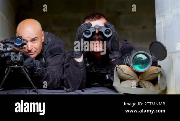 Front view of caucasian military soldiers looking through binoculars ...
