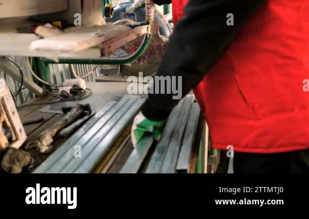 plastic windows. Worker Cutting PVC Profile with Circular Saw.PVC ...