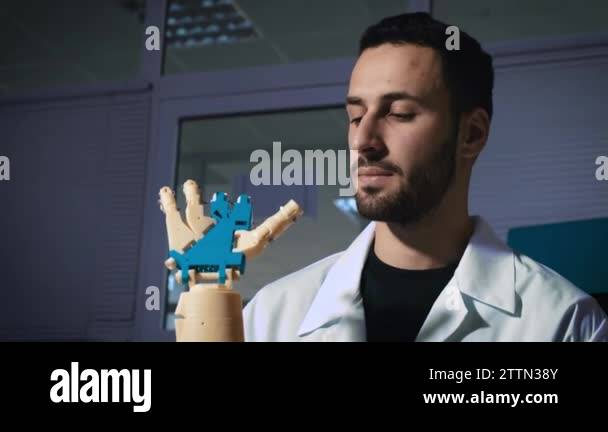 male engineer scientist experiences a bionic prosthesis of a mechanical ...