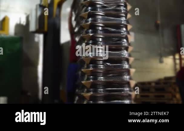 Stamped discs are placed on a shipping container wrapping on a packing ...