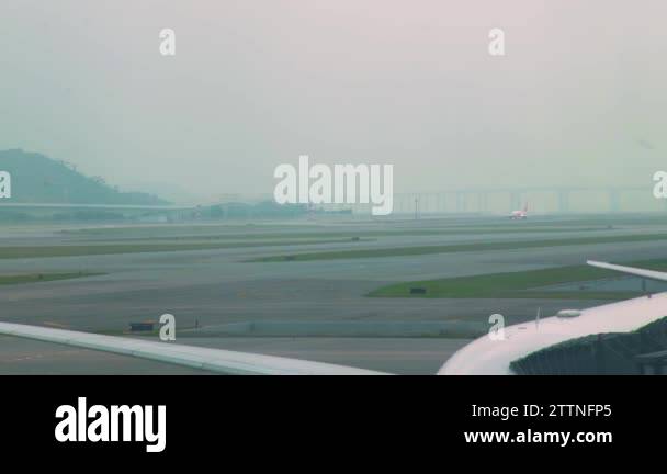 Airplane driving on runway for taking off in airport terminal. Aircraft ...