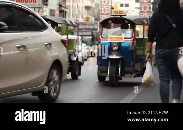 BANGKOK, THAILAND - Dec 15 2018: Cars and shops on Yaowarat road. Chinatown with notable Chinese ...