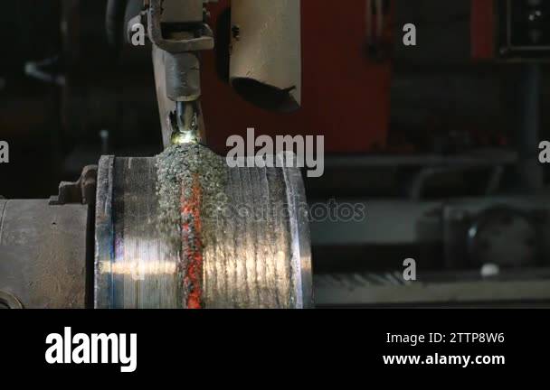 Welding robots apply overlay weld protection on the pipe disks ...