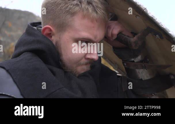 Warrior screams with pain from arrow in abdomen Stock Video Footage - Alamy