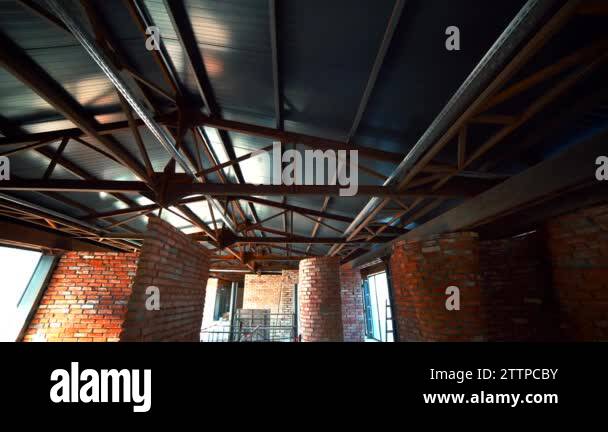 Camera moves along the construction site of modern loft with metal ...