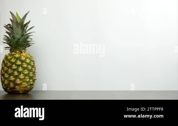 Pineapple appears in the frame, spinning and leaving the frame. One ...