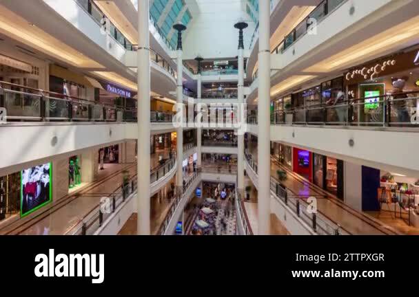 KUALA LUMPUR, MALAYSIA - JANUARY 2016: famous petronas towers suria klcc mall walking by circa ...