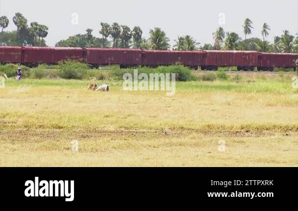 High speed train running on railroad track in India Stock Video Footage ...