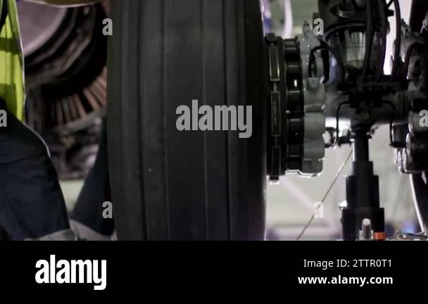 Calm workers controlling aircraft machine and chassis. Aircraft ...