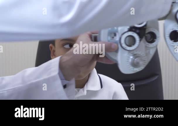 Little boys eye examination at optometrist ophthalmologist using ...